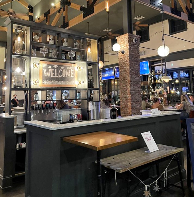 The bar welcomes you with illuminated warmth, promising good times and better drinks. Those hanging lights create the perfect golden glow.