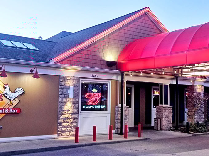As dusk settles, Ron's Roost glows with promise&mdash;that red awning isn't just an entrance, it's a portal to flavor country.