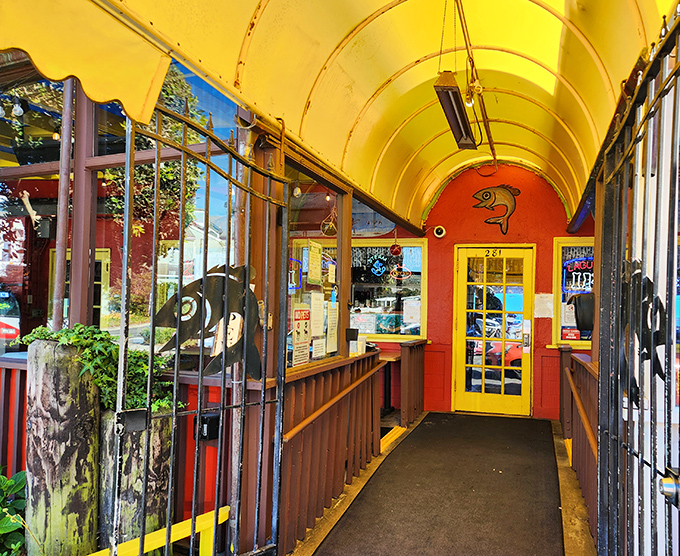 The entrance feels like walking into a cheerful nautical dream, where fish art and bright colors promise delicious things ahead.