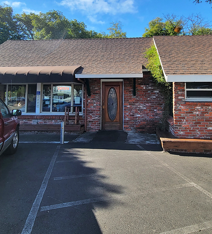 The entrance to breakfast paradise doesn't need to be fancy. That weathered brick exterior is like a secret handshake among those who know good food.