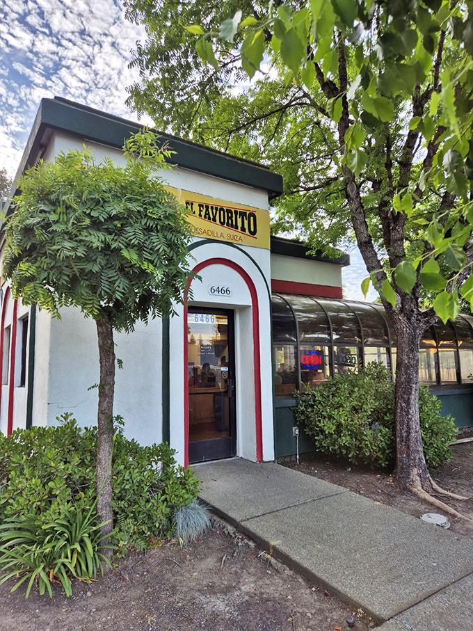 The entrance beckons with its cheerful yellow sign and distinctive arches. Your taste buds are already celebrating before you walk in.