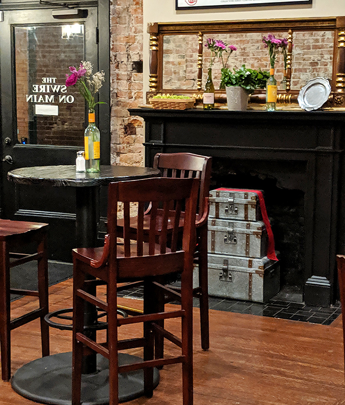 Vintage trunks by the fireplace remind us that the best journeys often end with good food in charming places like this. 