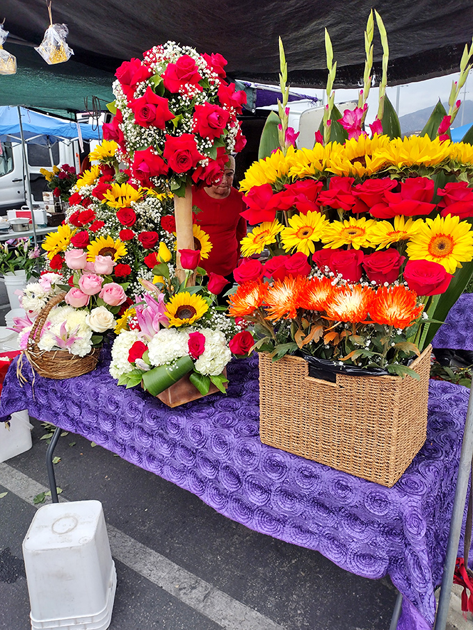 Fresh blooms bring garden center beauty to asphalt landscapes, proving flowers make everything more cheerful.