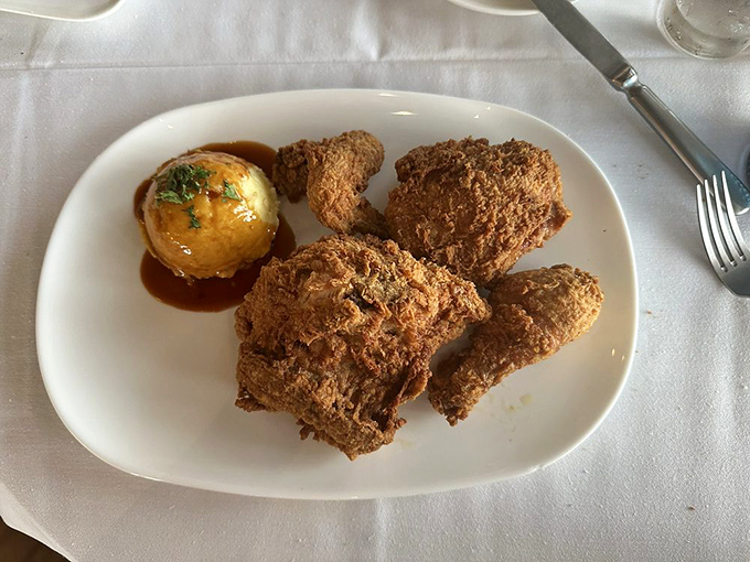 Fried chicken so perfectly golden, it makes you wonder if Colonel Sanders has been holding out on us all these years.