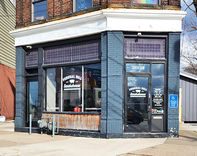 The corner storefront announces its purpose without fanfare. No neon, no gimmicks&mdash;just a promise of smoke and satisfaction inside.