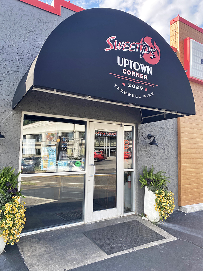 The iconic black awning serves as a beacon for BBQ pilgrims seeking salvation in the form of perfectly smoked meats.