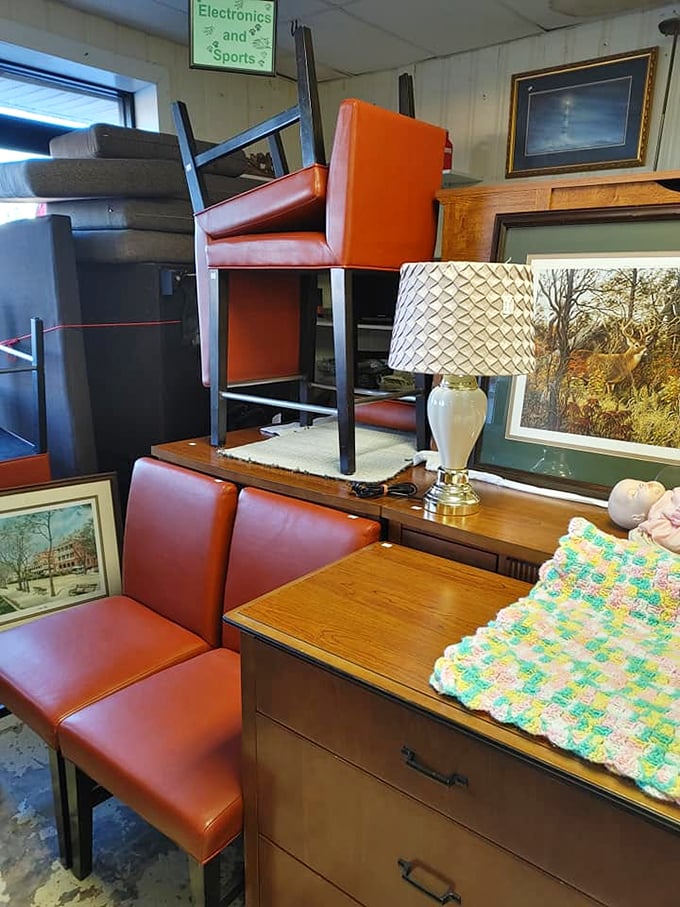 Mid-century meets modern in the furniture corner. Those orange vinyl chairs have seen things&mdash;and they're ready to see your living room next.
