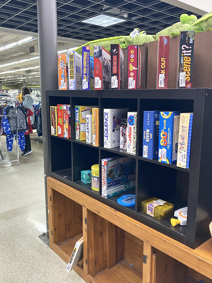 Board game bonanza! These shelves hold countless family game nights waiting to happen, from classic Monopoly battles to the obscure trivia game nobody remembers the rules for.