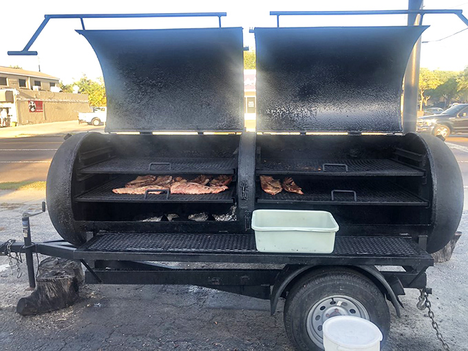 The source of all that heavenly aroma: a smoker that's seen more action than a Hollywood stuntman and delivers more satisfaction.