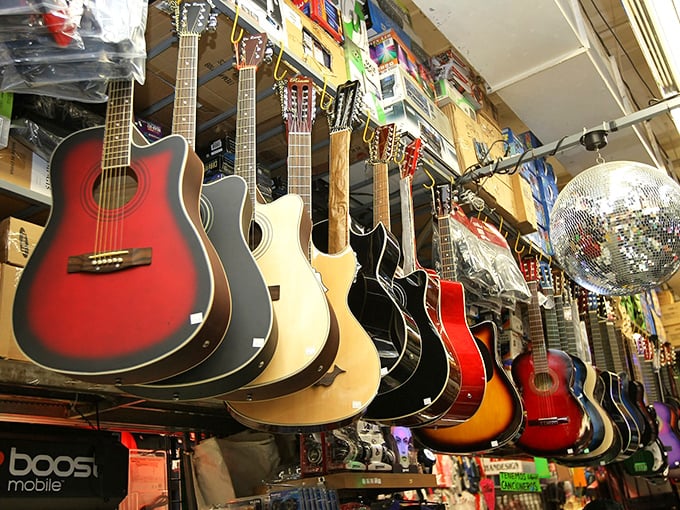 Guitar dreams hang in suspended animation, each instrument waiting for the right fingers to bring its music to life.