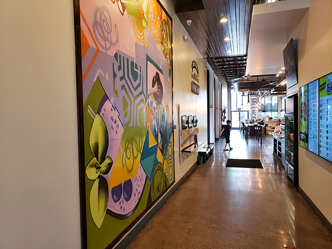 Walking this hallway feels like strolling through a modern art gallery where the main exhibit happens to be incredible burgers.