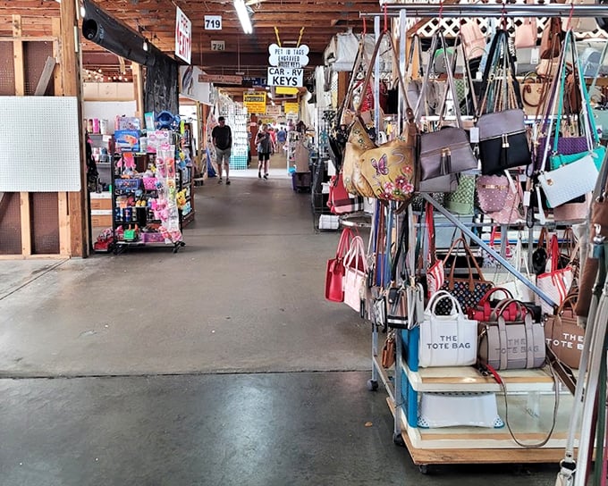 Handbag heaven stretches down the aisle, where designer-inspired purses hang like colorful fruit ready for the picking.
