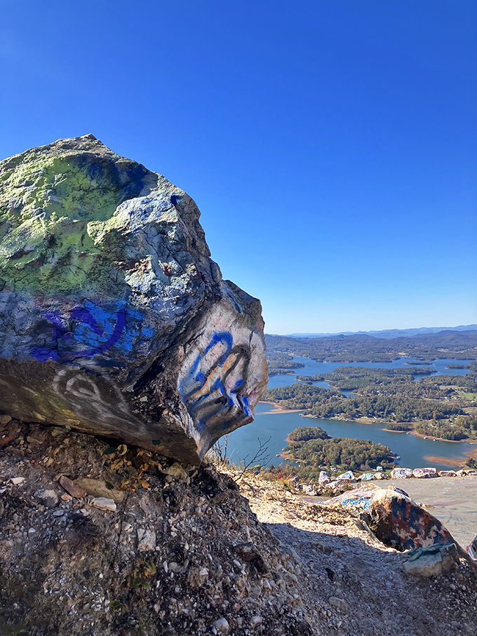 Rock art with a room with a view. Bell Mountain's painted boulders frame Lake Chatuge's winding shoreline like nature's own picture window.