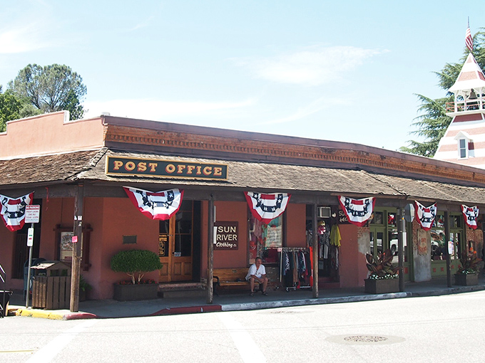 The historic Post Office stands as a testament to Auburn's enduring community spirit. Red, white, and blue bunting adds a touch of small-town celebration.