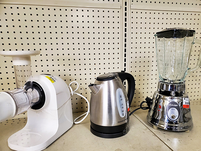 Kitchen appliance corner: where yesterday's wedding gifts become tomorrow's vintage finds. That chrome blender has probably made more margaritas than Jimmy Buffett.