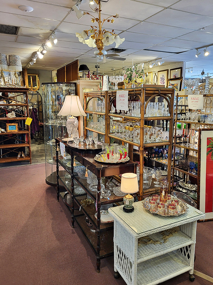 Chandeliers above, treasures below—this elegant display of crystal and silver creates a treasure hunt atmosphere for the discerning collector.