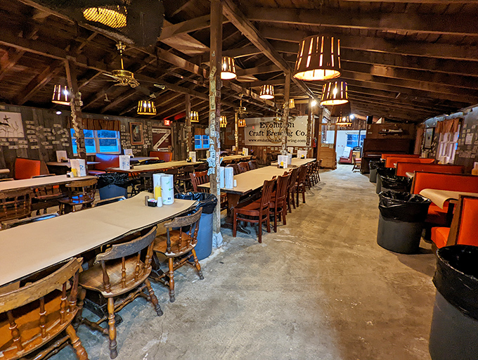 Tables ready for battle, where the only casualties will be empty stomachs and clean shirts. The wooden beams have absorbed decades of laughter.