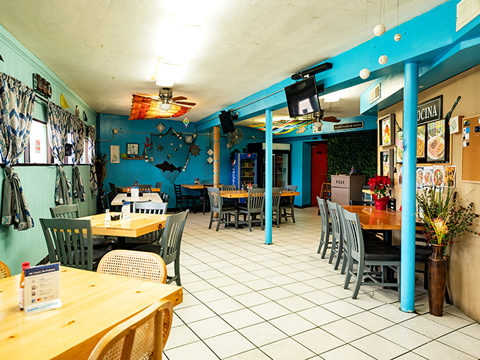 Turquoise walls and wooden tables create the perfect backdrop for the food memories you're about to make.