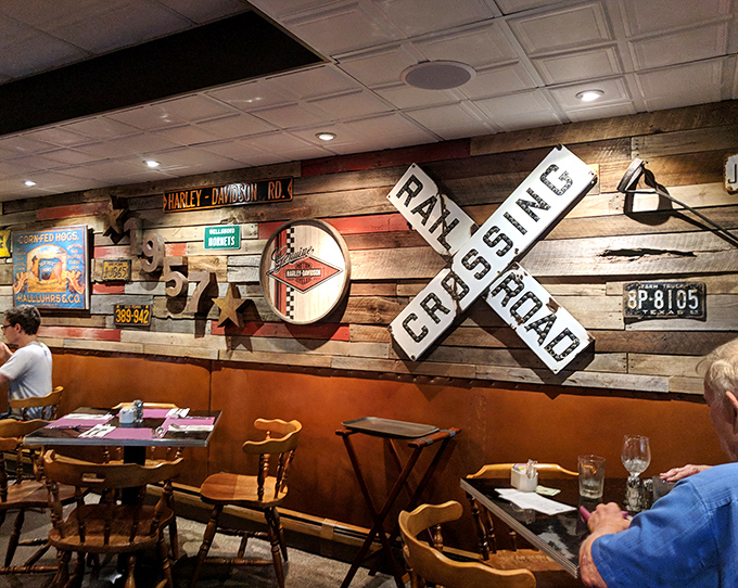 Railroad crossing meets roadhouse aesthetic—where every piece of memorabilia tells a story. The kind of authentic decor money can't buy, only time can create.