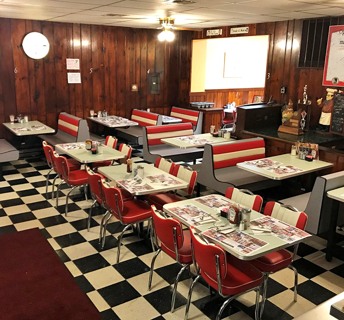 Wood paneling and red booths create the perfect backdrop for life's important discussions: politics, weather, and whether to order pie for dessert.