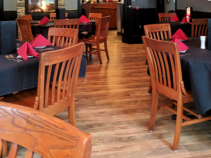 Warm wood tones and vibrant red napkins&mdash;the dining room where "I'll just try one bite of yours" becomes a delicious lie.