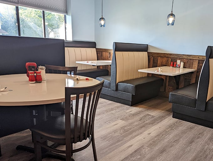 Modern meets nostalgic in this dining room where the pendant lights cast a glow that makes everyone look like they're in a food commercial.