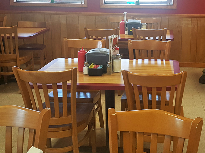 The quintessential diner table setup&mdash;simple wooden chairs, condiments within arm's reach, and enough space for your elbows when cutting into that country ham.