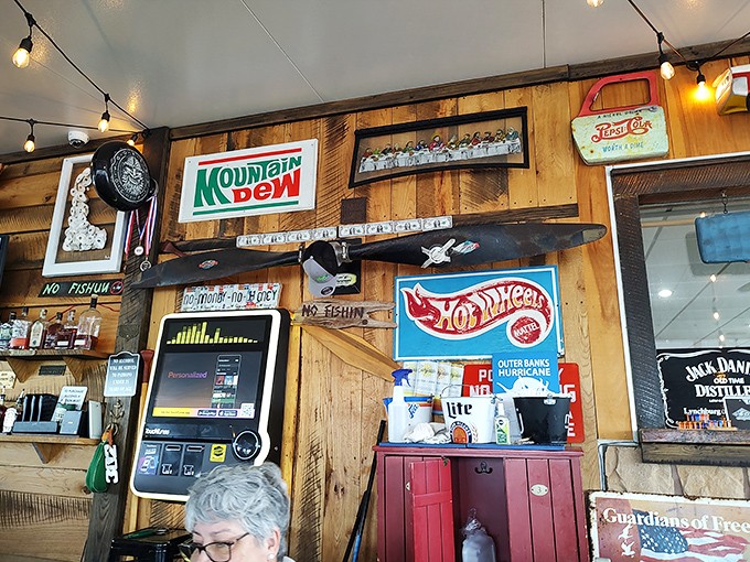 The walls tell stories of coastal life with vintage signs and maritime artifacts – décor that wasn't purchased but accumulated through authentic experience.