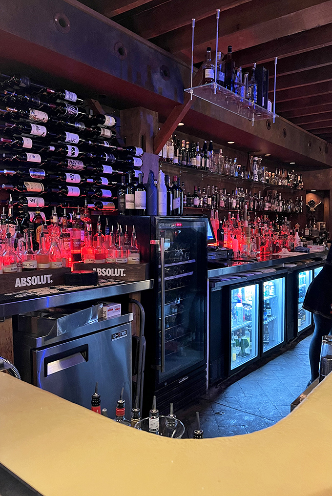 Vintage signs and American flags create a speakeasy vibe. This isn't just decoration&mdash;it's a time machine to when barns housed horses, not filet mignon.