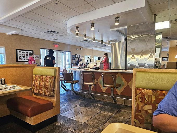 The counter-to-booth ratio is perfect diner mathematics. Every seat promises the same level of comfort and coffee refill frequency.