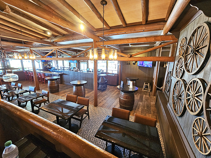 The dining room stretches out like a welcoming frontier lodge where strangers become fast friends.