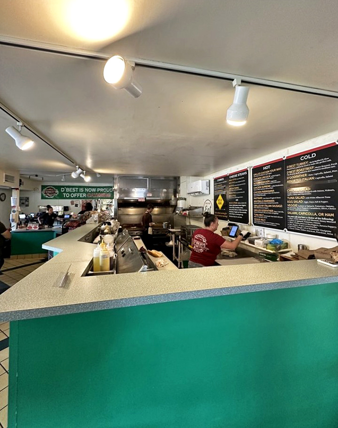 Behind the counter is where the magic happens. Sandwich artists at work in their studio, creating edible masterpieces one order at a time.