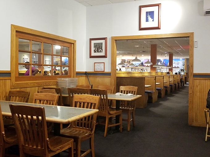 The dining area's wood paneling and simple decor say, "We spent our money on the food, not fancy chandeliers." 