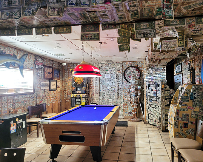 The pool table waits for challengers beneath a canopy of currency&mdash;games here aren't just games, they're desert traditions.