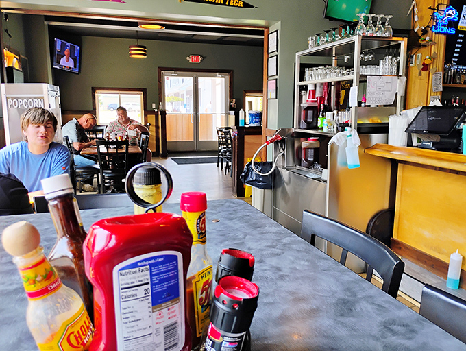 Where condiments become table decor and every seat offers a view of something delicious. The casual vibe says "come as you are" &ndash; hungry is the only dress code.