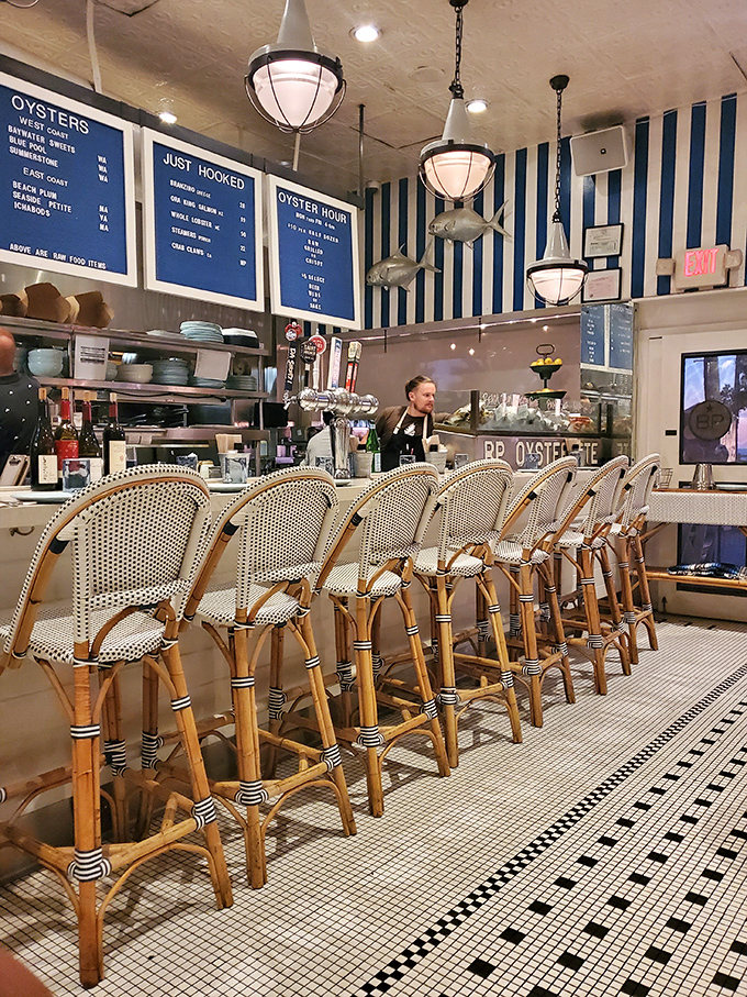 The bar area invites you to pull up a stool and watch the ballet of oyster shucking while contemplating life's important questions&mdash;like "one dozen or two?"