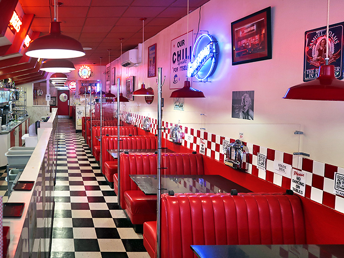 The diner stretches before you like a red vinyl dream sequence, each booth a potential setting for your own personal Americana moment.