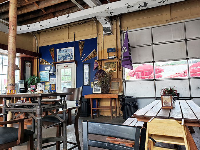 The rustic interior doesn't just house diners&mdash;it preserves BBQ traditions with every wooden beam and blue wall that's absorbed decades of smoky stories.