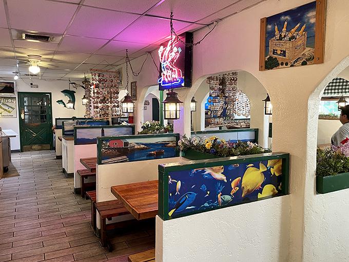 Nautical-themed dividers and cozy booths create little islands of privacy—perfect for those intimate moments between you and your seafood platter.