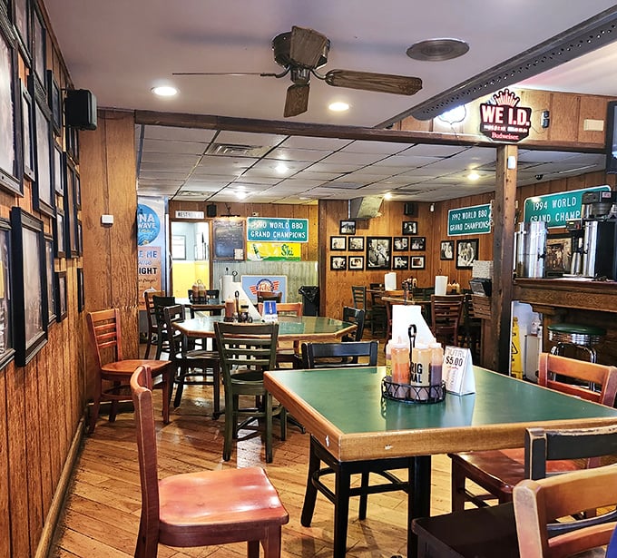 Green-topped tables and wood-paneled walls create the perfect backdrop for the serious business of BBQ appreciation.
