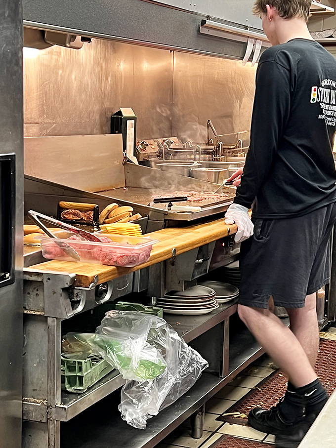 Behind-the-scenes choreography: where teenagers learn life skills flipping burgers that will feed both stomachs and small-town legends.