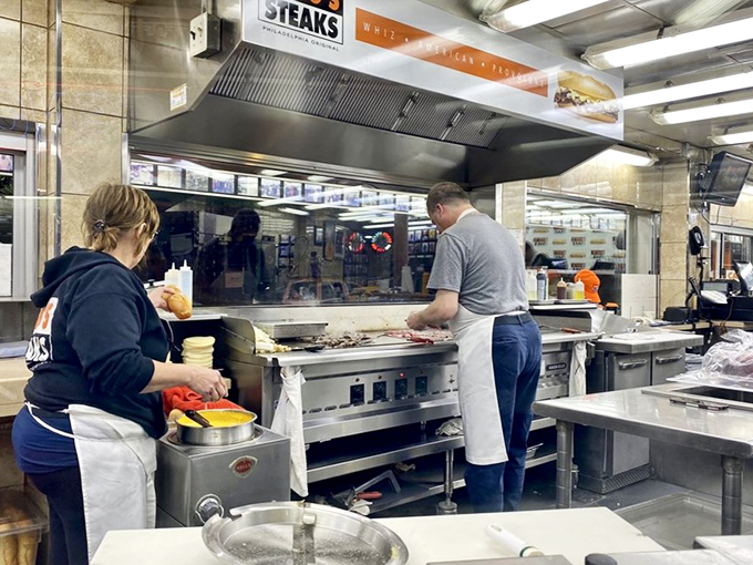 Behind every great cheesesteak is a kitchen where timing and technique are everything. The dance of the spatulas begins.