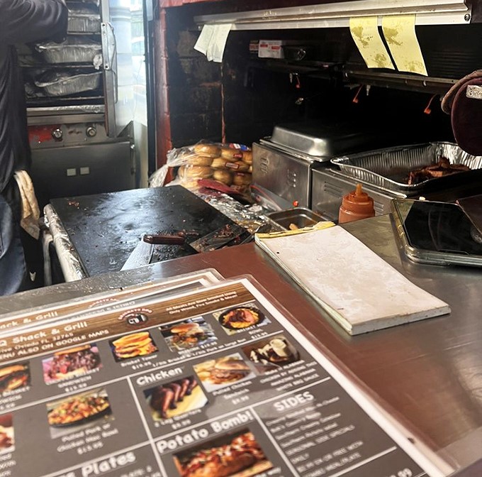A glimpse into the kitchen battlefield where smoke meets meat. Those well-seasoned cooking surfaces tell stories of thousands of satisfied customers.