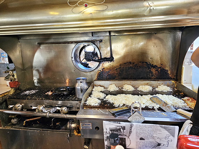 Where the magic happens&mdash;a well-seasoned grill that's seen more action than an action movie stunt double, creating breakfast masterpieces daily.