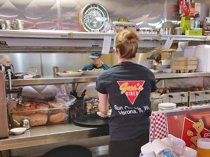 Behind the scenes, the kitchen crew works their magic, turning simple ingredients into the plates that keep folks driving across Wisconsin for just one more bite.