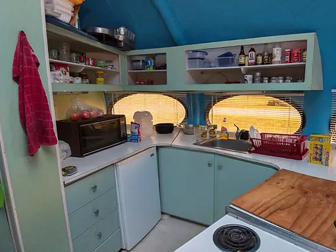 The final frontier of compact cooking! The Futuro's curved kitchen features ingenious space-saving design with a delightful retro color scheme.