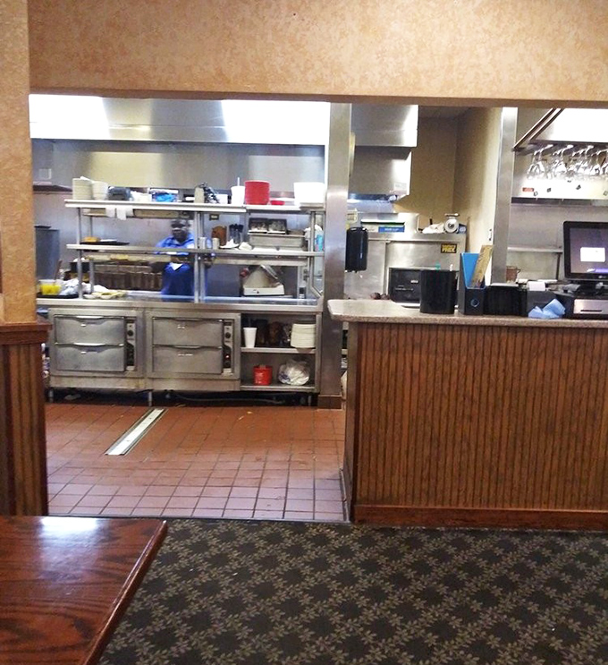 Behind the scenes where smoke meets meat – the kitchen sanctuary where BBQ magic happens one patient hour at a time.