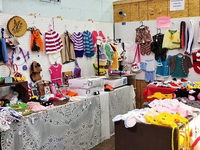 Handcrafted baby clothes and colorful knits hang hopefully, waiting for new little ones to continue their story of warmth and care. 