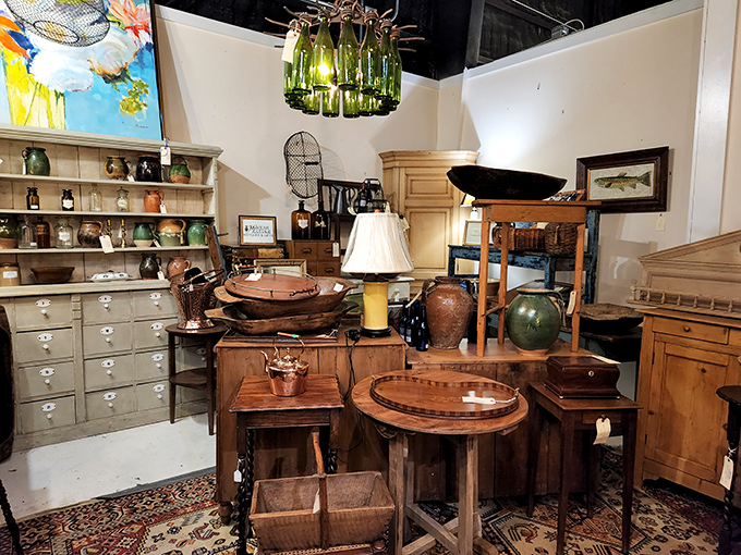 Warm wood tones and vintage vessels create a tableau that whispers of hunting lodges and country estates.