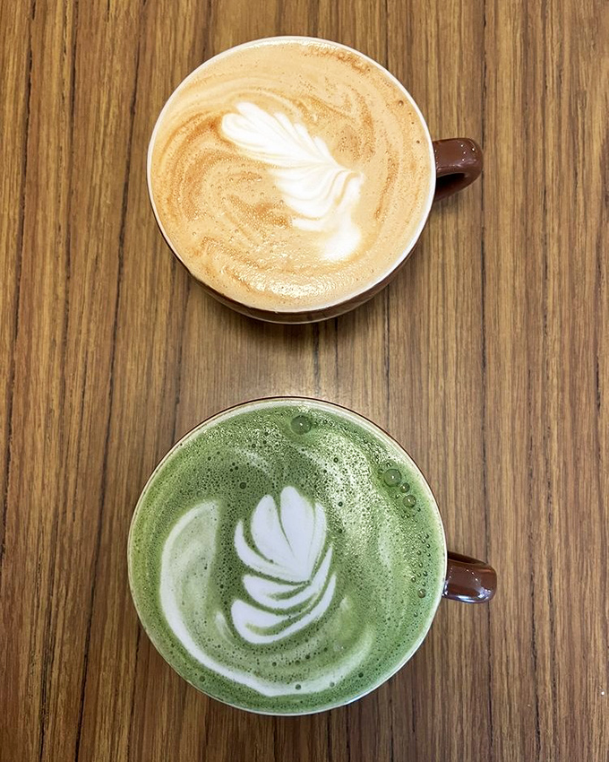 Latte art that belongs in a gallery. The matcha version below isn't just a drink&mdash;it's a statement piece in a cup.